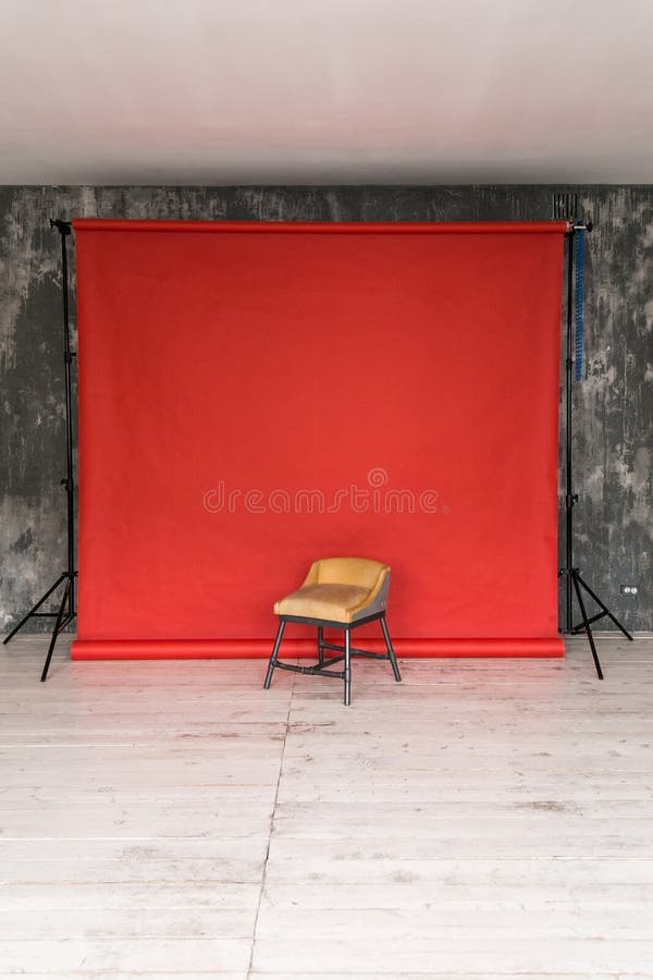 The Working Space of the Photo Studio with a Red Paper Background and ...
