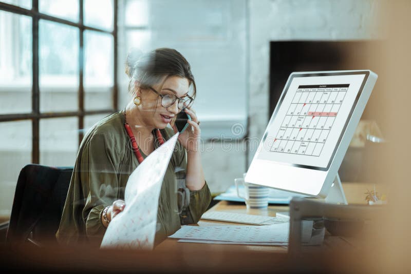 Businesswoman Working Near Computer and Speaking on Phone Stock Photo ...