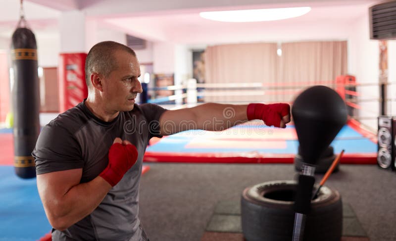 Working the speed bag stock photo. Image of boxer, hands - 151864584