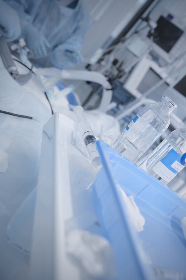 Working Staff in Hospital Ward with an Medical Objects in Foreground ...