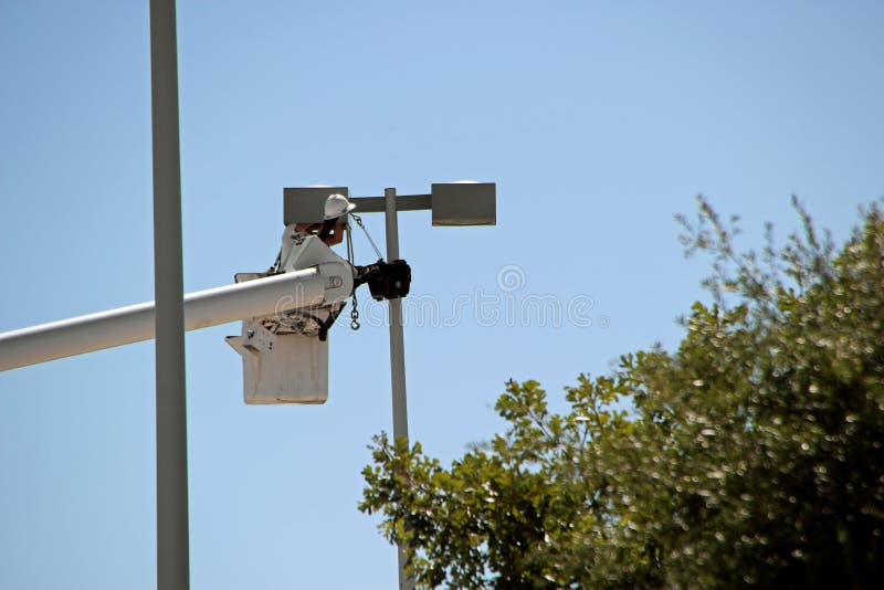 Working on street light stock image. Image of connect - 90373765