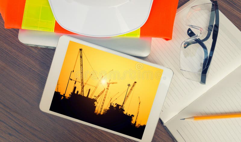 Working Table Engineer with Tablet and Tools in Oil Refinery Industry ...