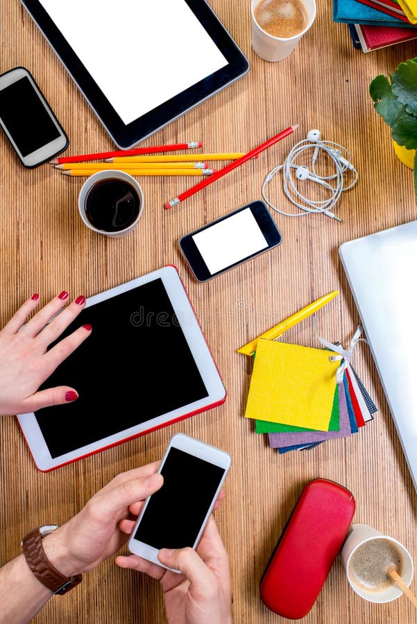 Working on Table with Gadgets Stock Image - Image of phone, group: 49399809