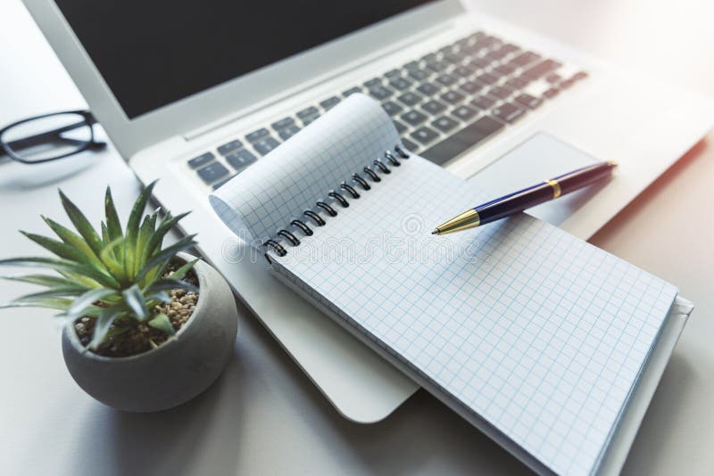 Working Table with Laptop, Empty Notepad Nad Pen on White Desk. Top ...
