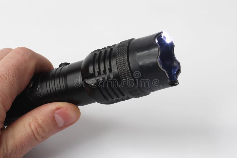 Working Taser in Hand on White Background Stock Image - Image of stun ...