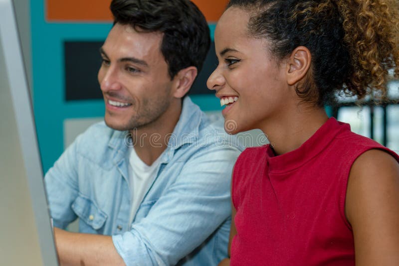 Working Couple Happy with Working Together in Office with Computer ...