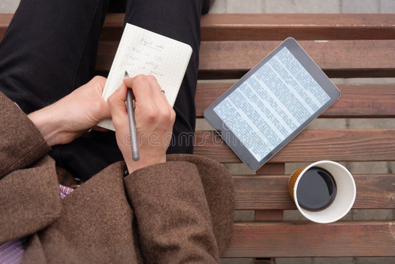 Working with Text Outside in Town with Note Pad and Tablet Computer ...