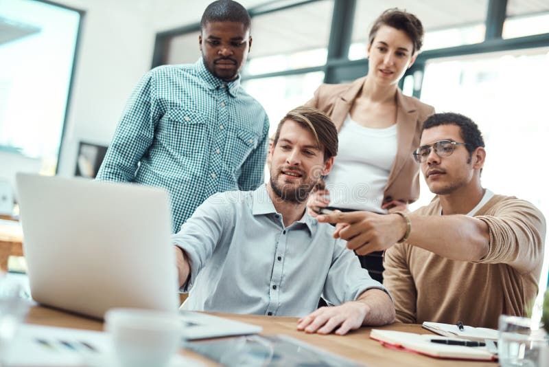 Working on Their Group Task. a Group of Businesspeople Working Together ...