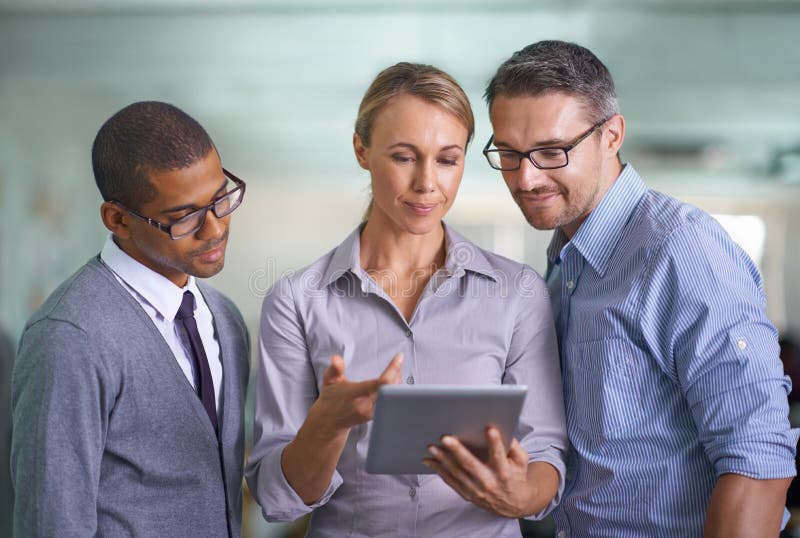 Working, Thinking and Planning on a Tablet of a Business Team ... Working, Thinking and Planning on a Tablet of a Business Team ...