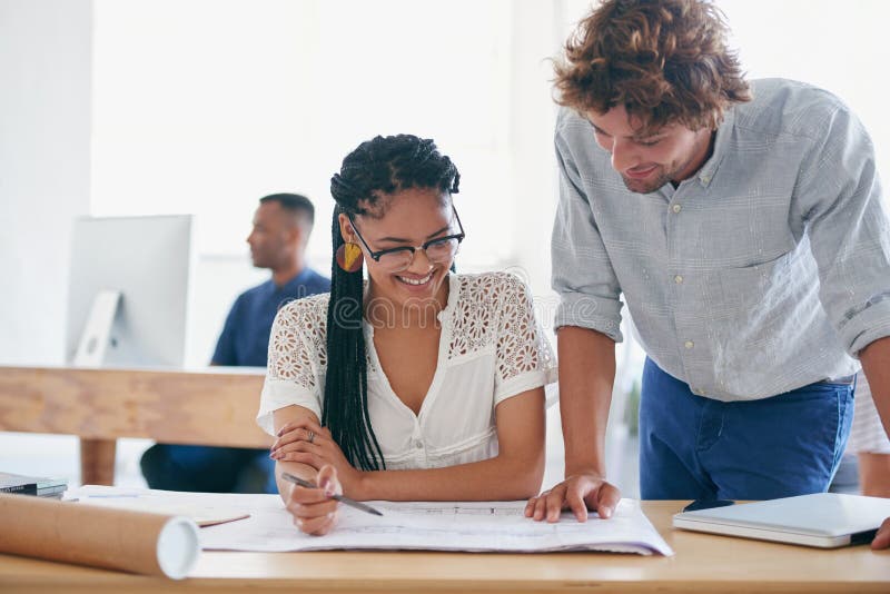 Working Together for Better Results. Two Young Designers Working ...