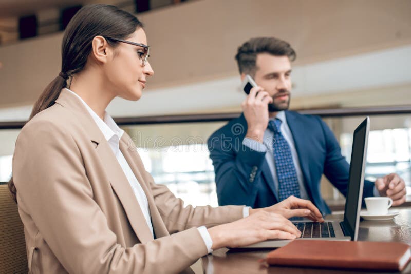 Business Partners Working Together on a Project in the Office Stock ...