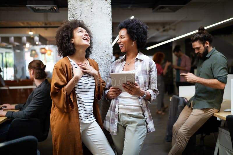 Working Together on Project. Happy Young Business Colleagues Working in ...