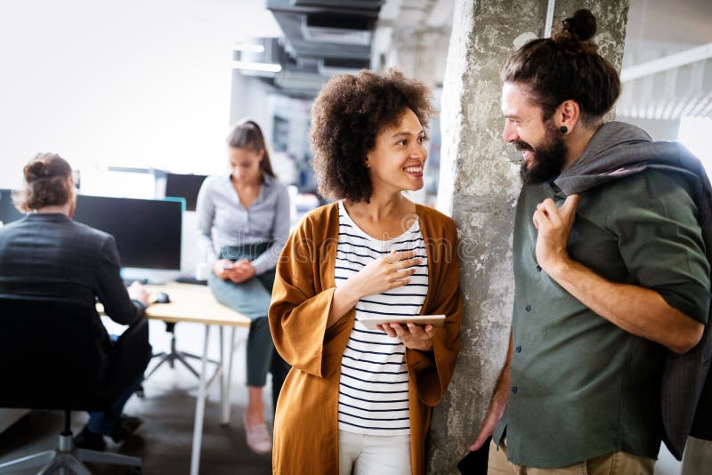 Working Together on Project. Happy Young Business Colleagues Working in ... Working Together on Project. Happy Young Business Colleagues Working in ...