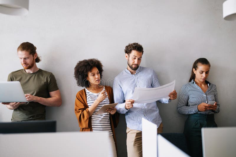 Working Together on Project. Happy Young Business Colleagues Working in ...