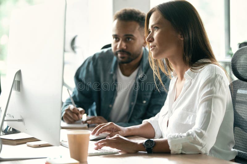 Working Together on Project. Two Business Colleagues Working on ...