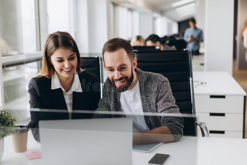 Working Together on Project. Two Young Business Colleagues Working on ...