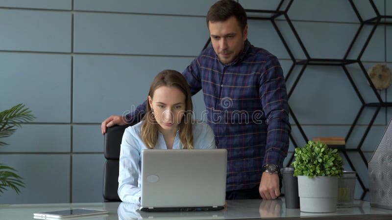 Working Together on Project. Two Young Business Colleagues Working on ...