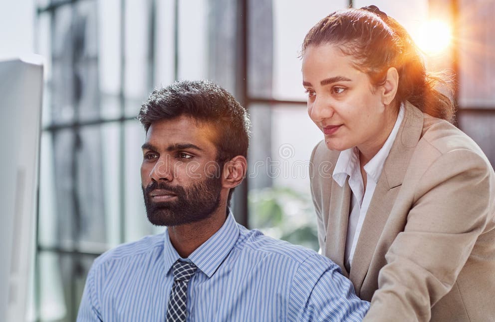 Working Together on Project. Two Young Business Colleagues Working on ...