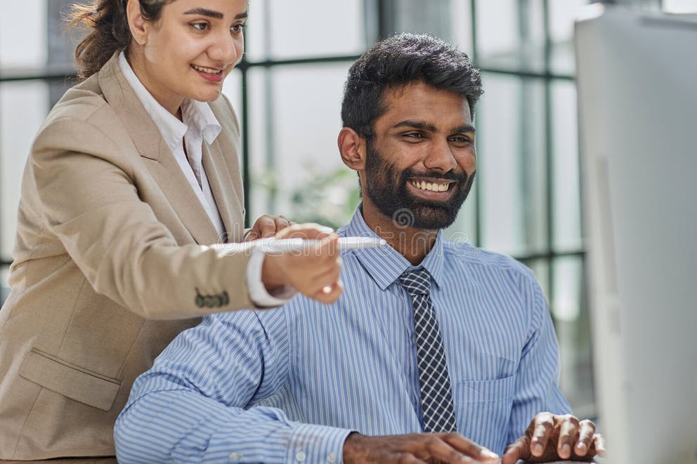 Working Together on Project. Two Young Business Colleagues Working on ...