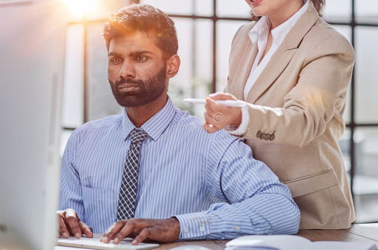 Working Together on Project. Two Young Business Colleagues Working on ...