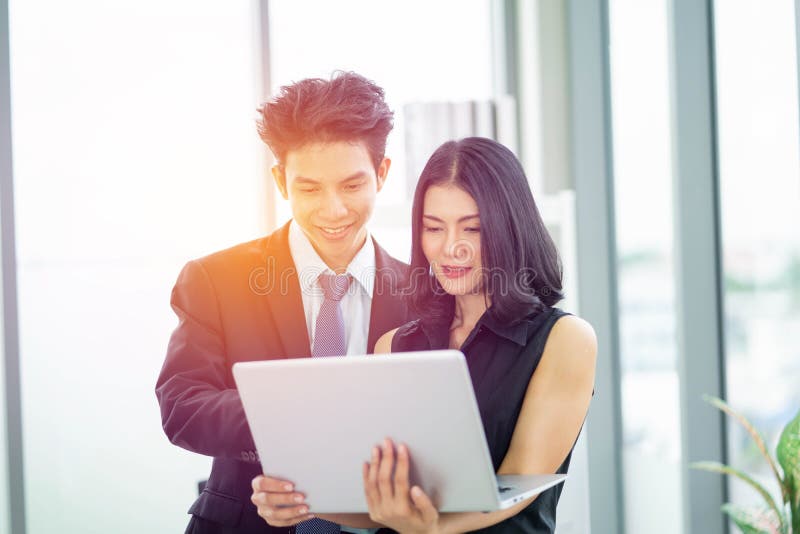 Working Together on Project. Two Young Business Colleagues Working on ...