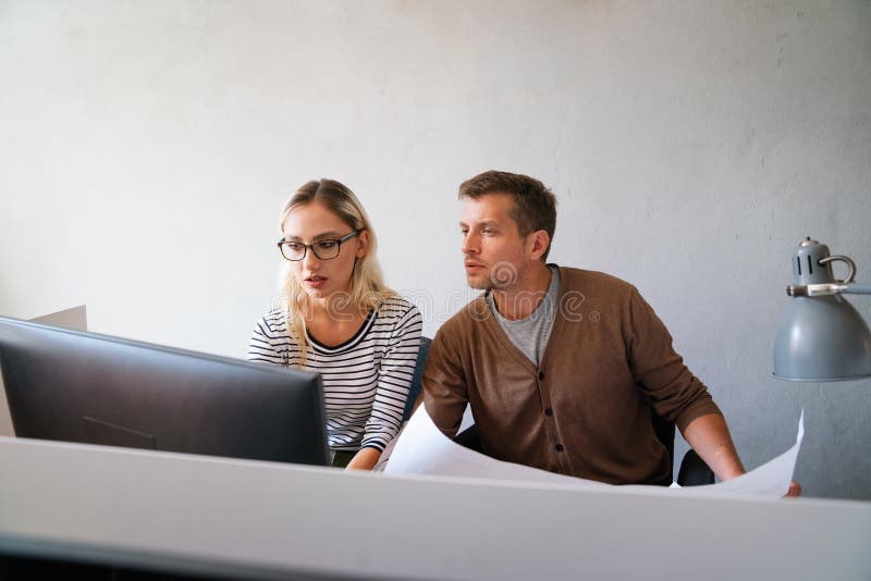 Working Together on Project. Two Young Business Colleagues Working ...