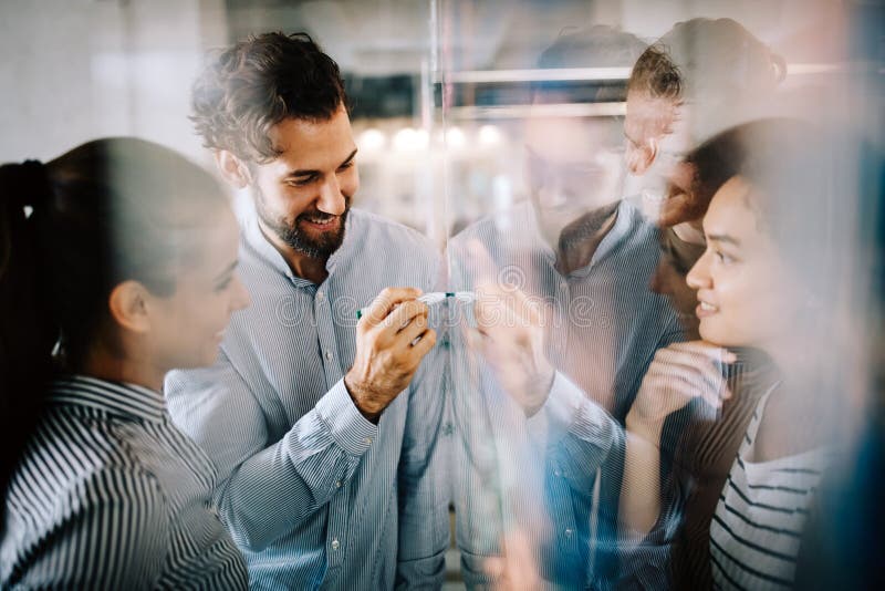 Working Together on Project. Happy Young Business Colleagues Working in ... Working Together on Project. Happy Young Business Colleagues Working in ...