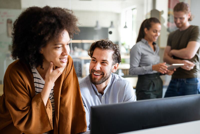 Working Together on Project. Happy Young Business Colleagues Working in ... Working Together on Project. Happy Young Business Colleagues Working in ...
