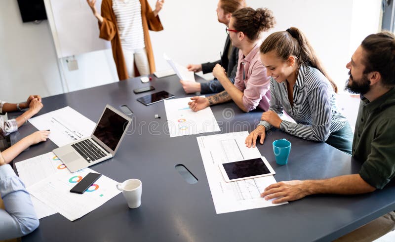 Working Together on Project. Happy Young Business Colleagues Working in ... Working Together on Project. Happy Young Business Colleagues Working in ...