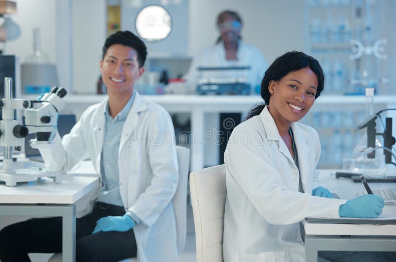 Working Together To Change the Future. Two Lab Workers Together in ...