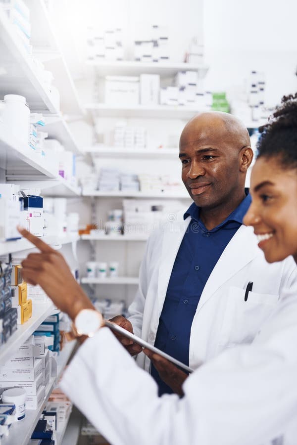 Working Together for Your Wellbeing. Two Pharmacists Doing Inventory in ...