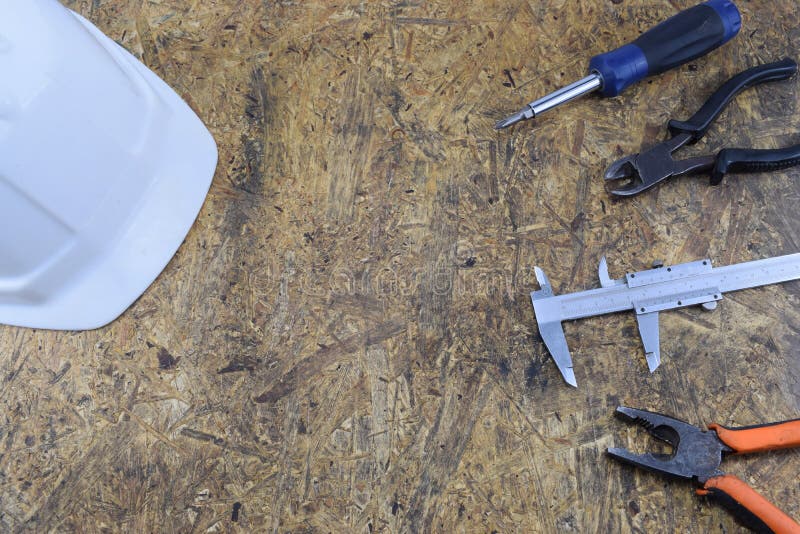 Working Tools of a Builder on a Construction Site, Lying on a Wooden ...