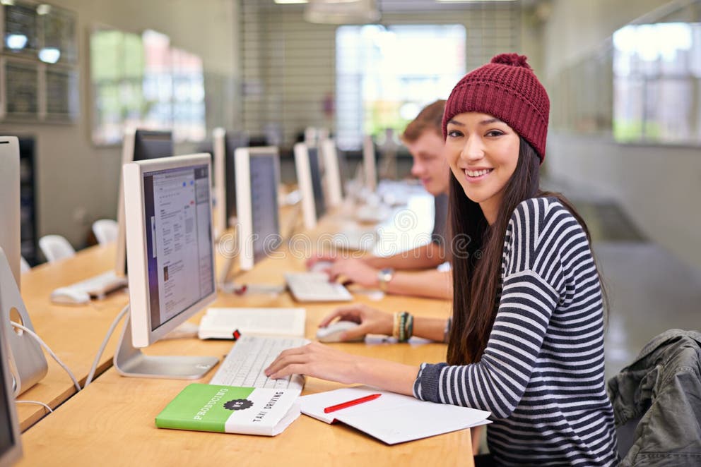 Working Towards that a Grade. Students Working on Computers in a University Library. Stock Photo ...