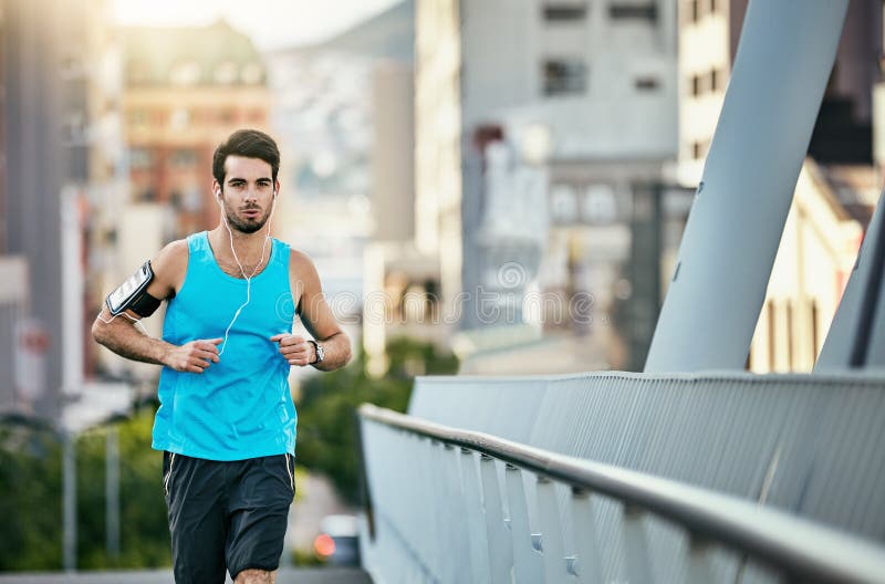 Working Up a Sweat. a Handsome Young Man Working Out in the City. Stock ...
