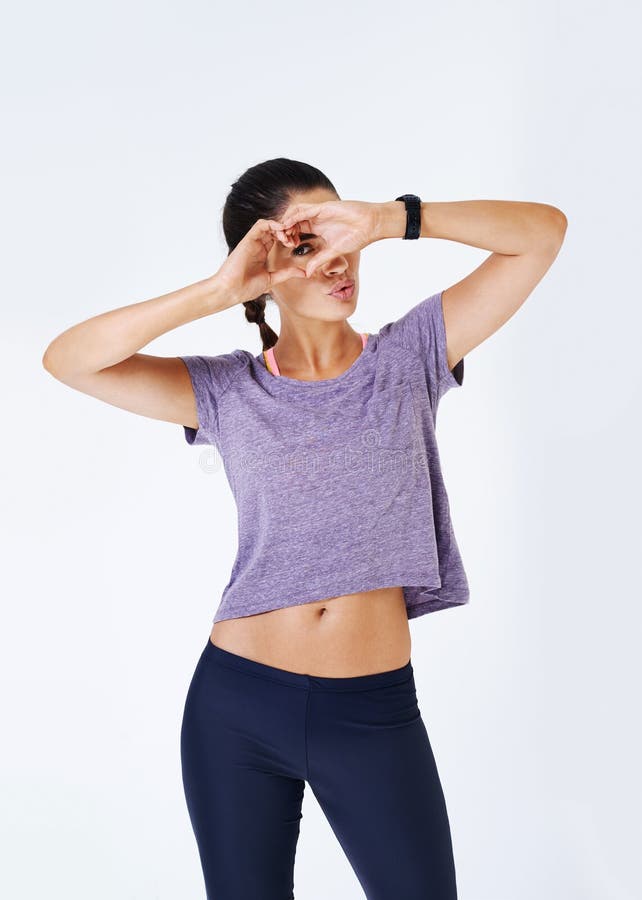 Working Up a Sweat. Studio Shot of an Attractive Young Woman Working ...