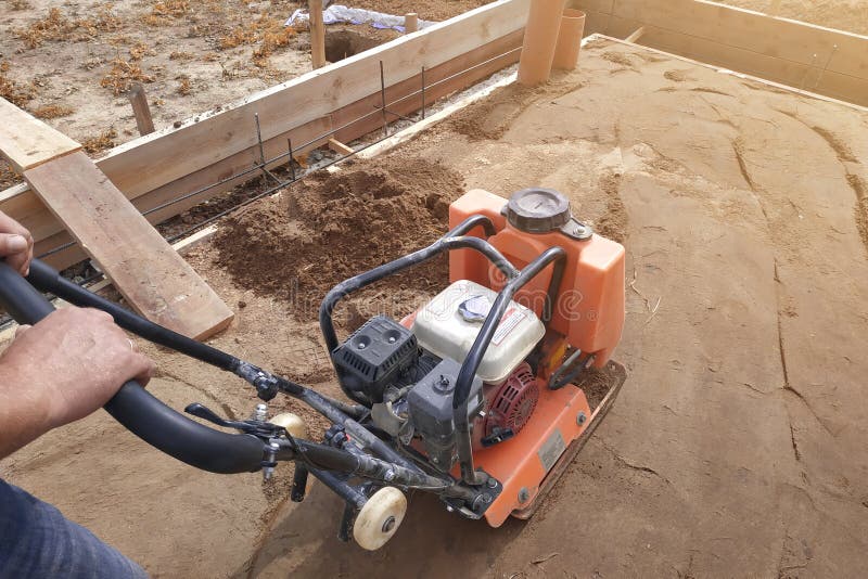 Working with a Vibrating Machine and Equipment, Soil Compaction with a ...