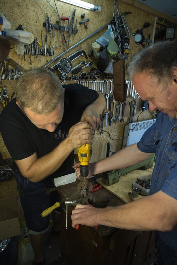 Working with a Vise and Drill. the Master Uses a Drill. Portrait of a ...