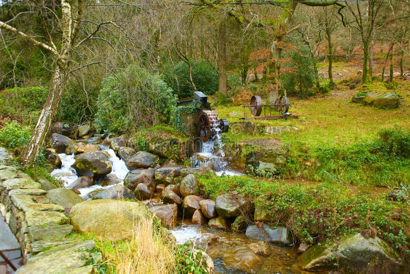 Working Water Mill Wheel with Falling Water in the Village. Stock Image ...