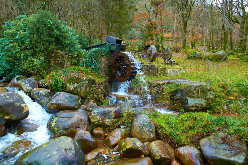 Working Water Mill Wheel with Falling Water in the Village. Stock Photo ...