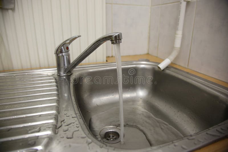 Working Water Tap in a Kitchen Stock Photo - Image of moving, chrome ...
