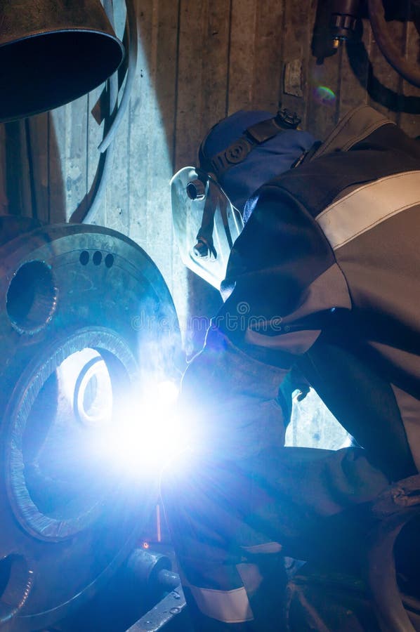 Working Welder at Work in Low Light Stock Image - Image of steel, flash ...