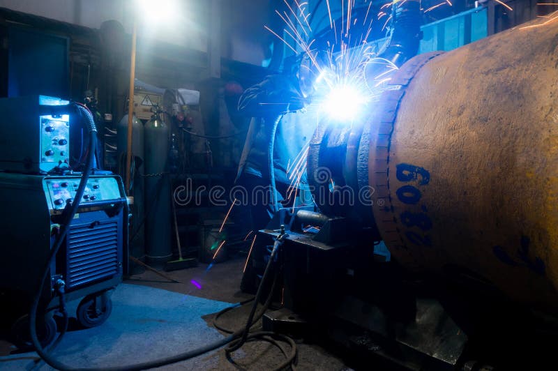 Working Welder at Work in Low Light Stock Photo - Image of smoke ...