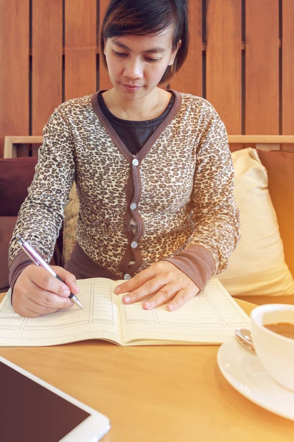 Working Woman Holding a Pen and Writing Stock Photo - Image of woman ...