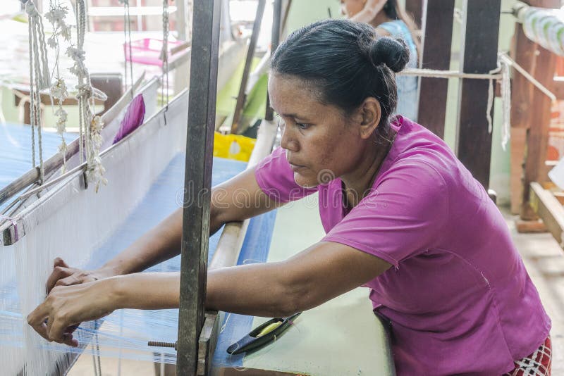 Working woman by weaving editorial stock image. Image of worker - 91801624