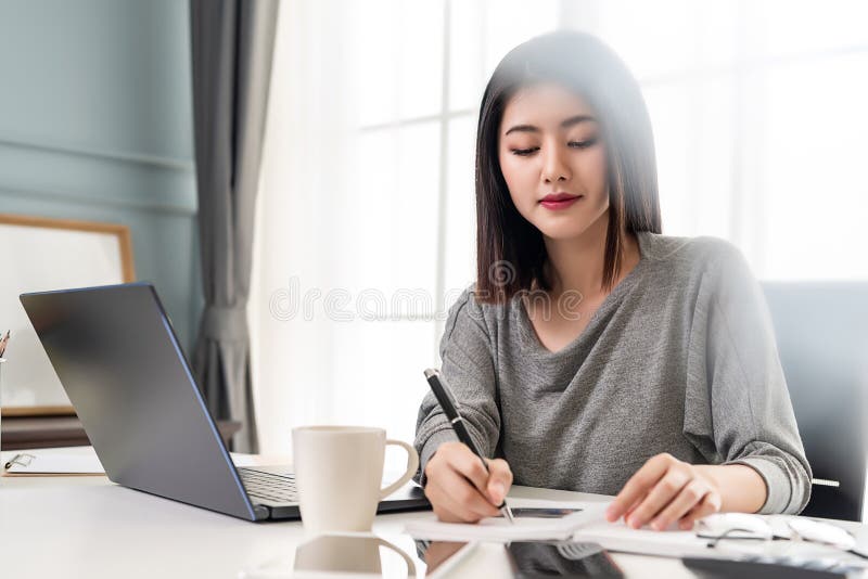 Working Woman Writing a Note on Her Office Table Stock Photo - Image of ...