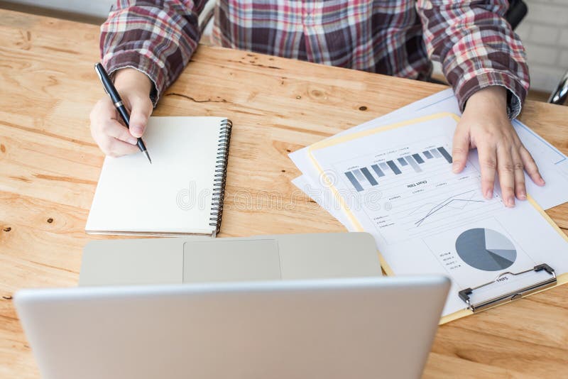 A Working Wooden Desk(table) with Notebook Computer, Coffee Cup, Paper ...