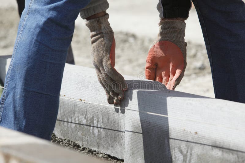Workman aligning bricks stock image. Image of gloved, fitting - 9451197