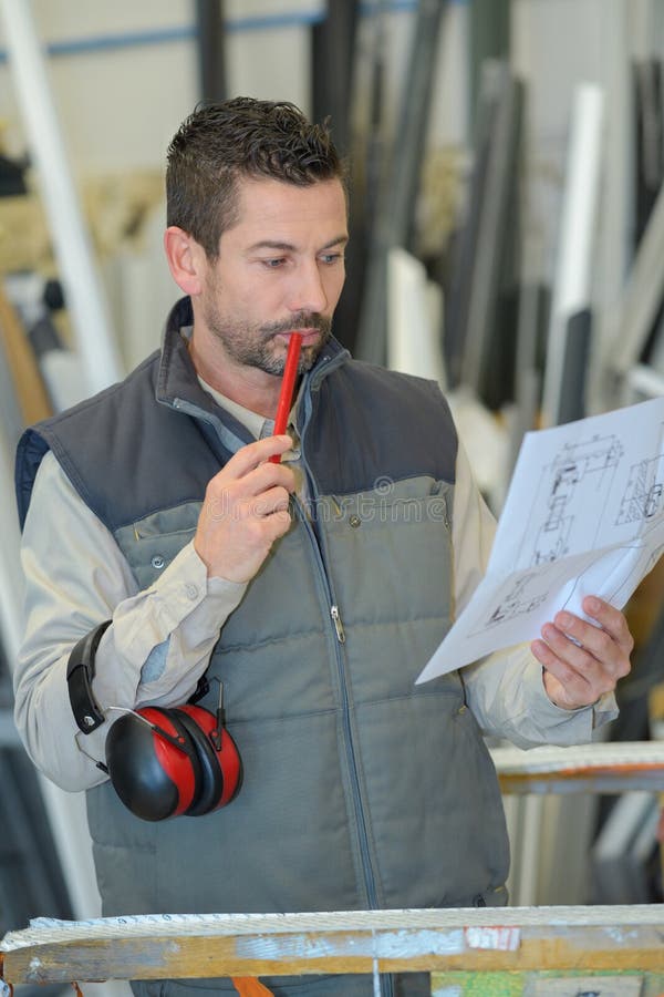 Workman Checking Plan Overfulfilment at Factory Stock Photo - Image of ...