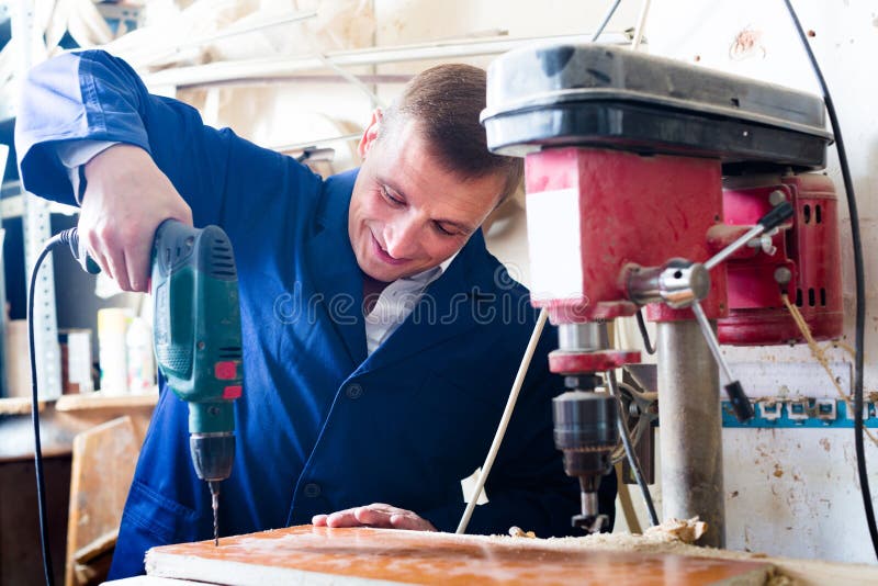 ï»¿workman drilling planks stock photo. Image of professional - 82899334
