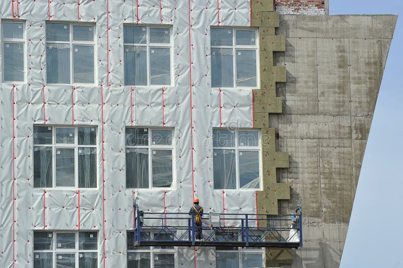 Workman in a Hanging Cradle at the Construction Site Stock Image ...